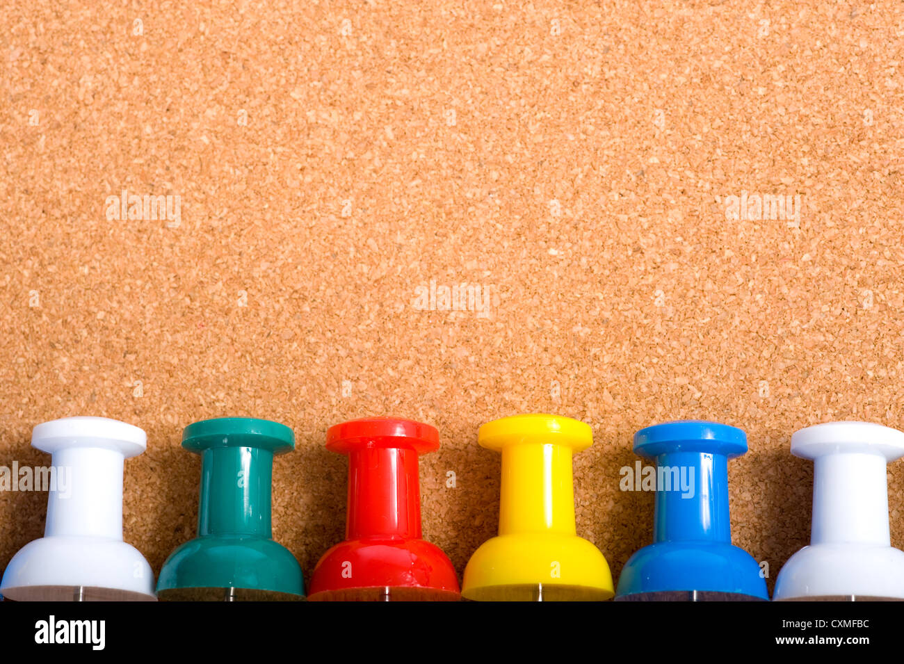 a bulletin board or cork board background with push pins and copy space ...