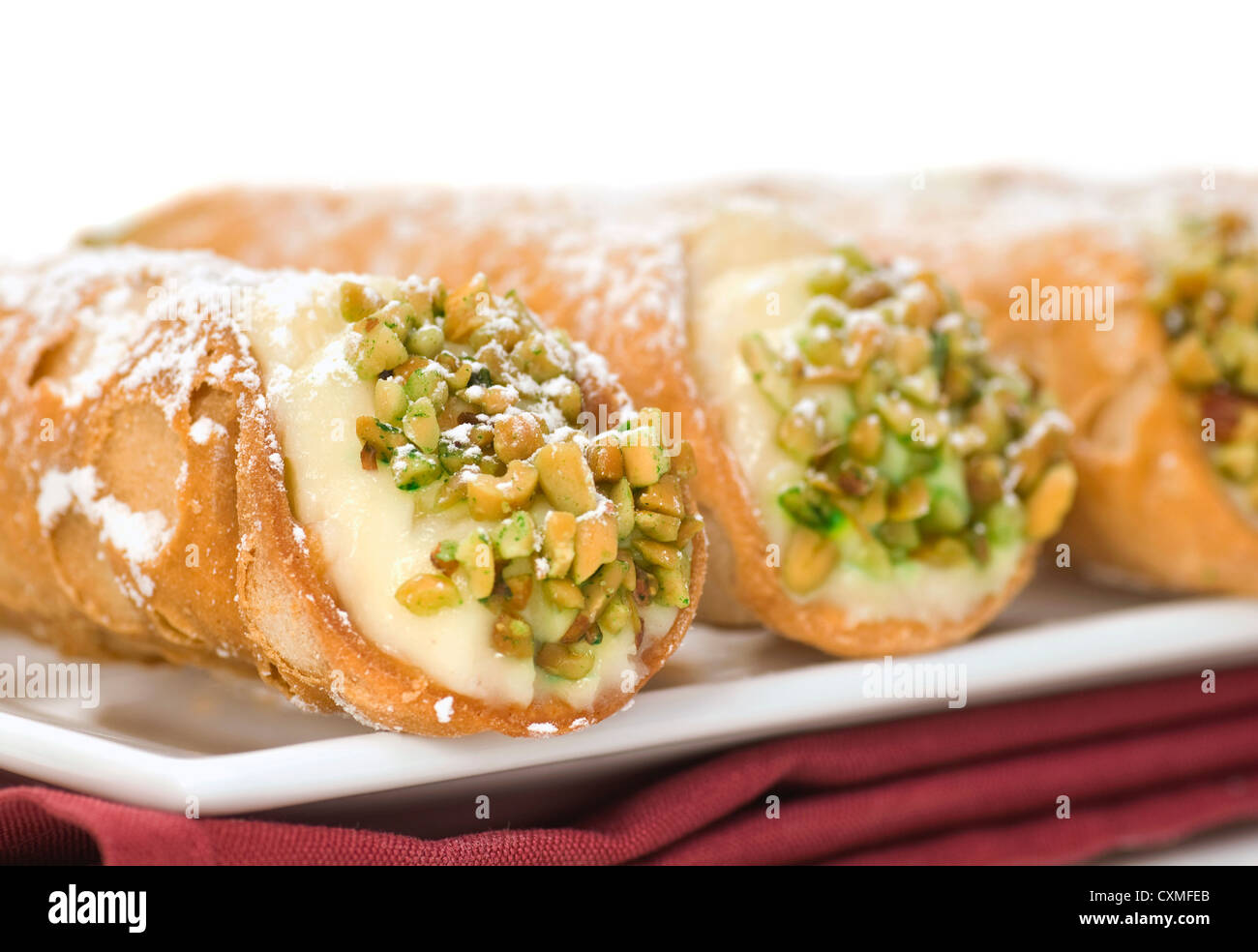Platter of freshly baked Italian Cannoli dusted with powdered sugar ...