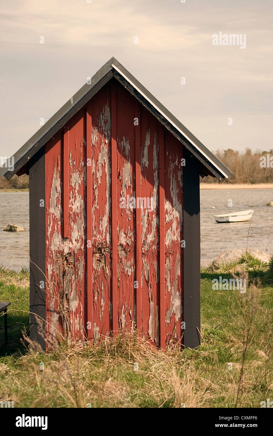 Red boathouse by the sea hi-res stock photography and images - Alamy
