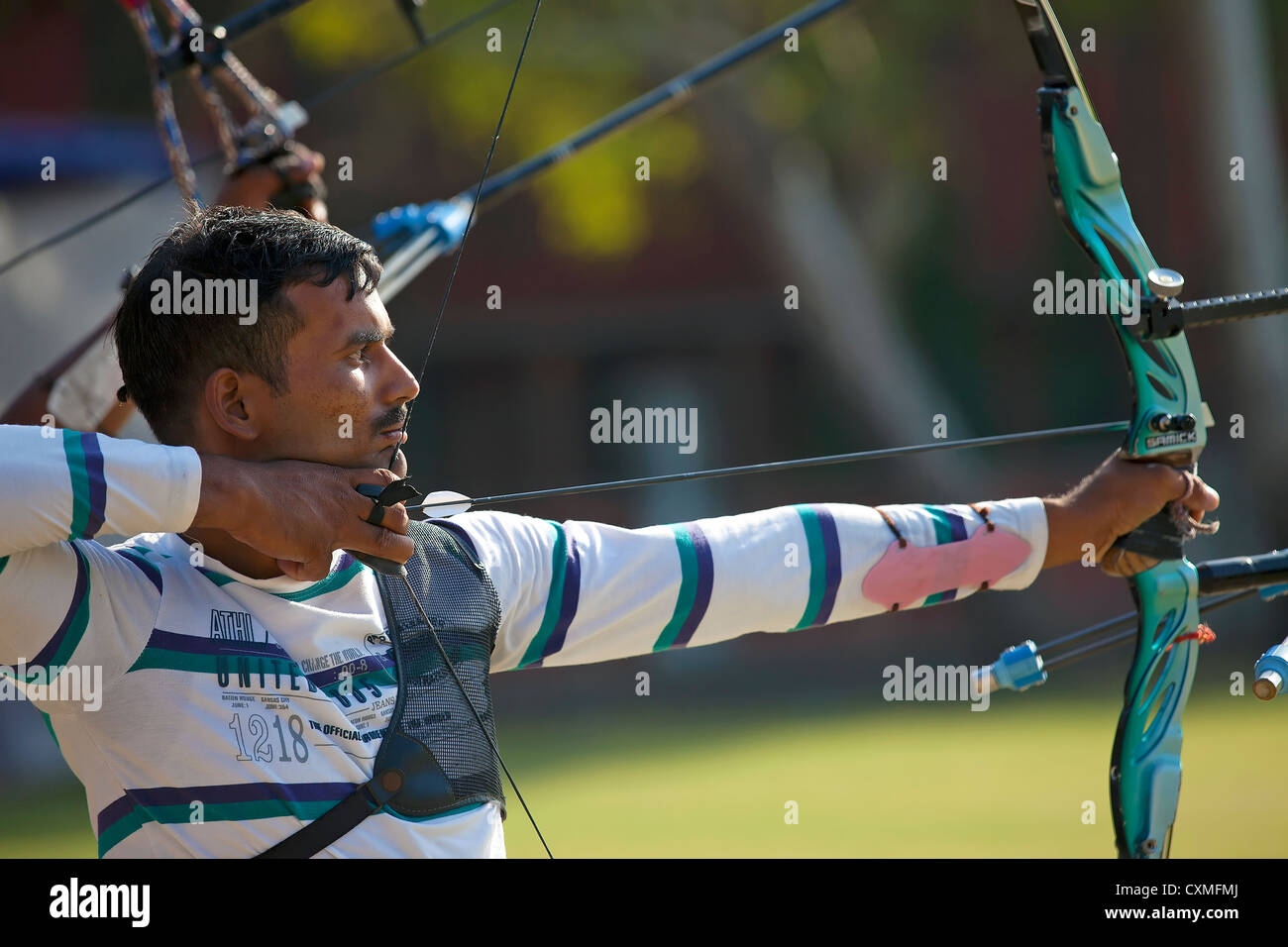 Sportsperson practicing archery Stock Photo - Alamy