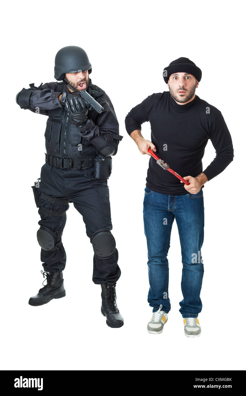 a scared burglar busted by a swat or police officer Stock Photo - Alamy