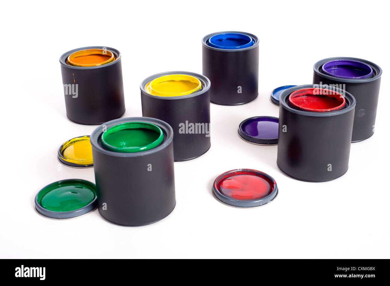 Colorful cans of paint on a white background forming a colorful ...