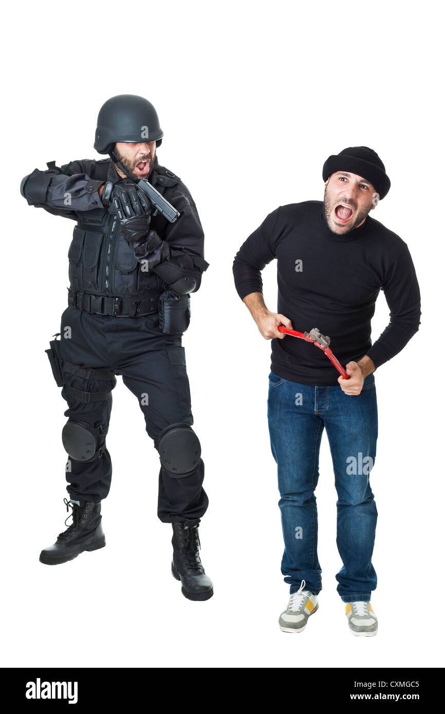 Full length of a police officer arresting young man for breaking ...