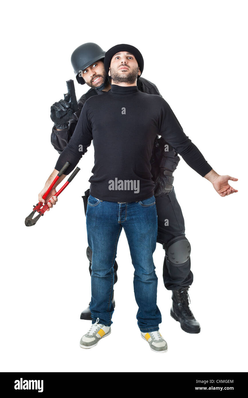 a scared burglar busted by a swat or police officer Stock Photo - Alamy