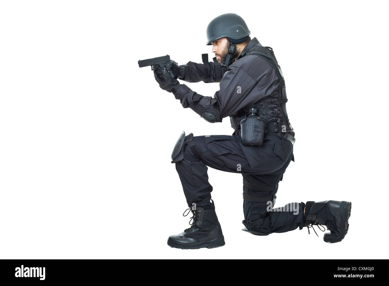 a swat agent wearing a bulletproof vest and aiming with a gun Stock ...