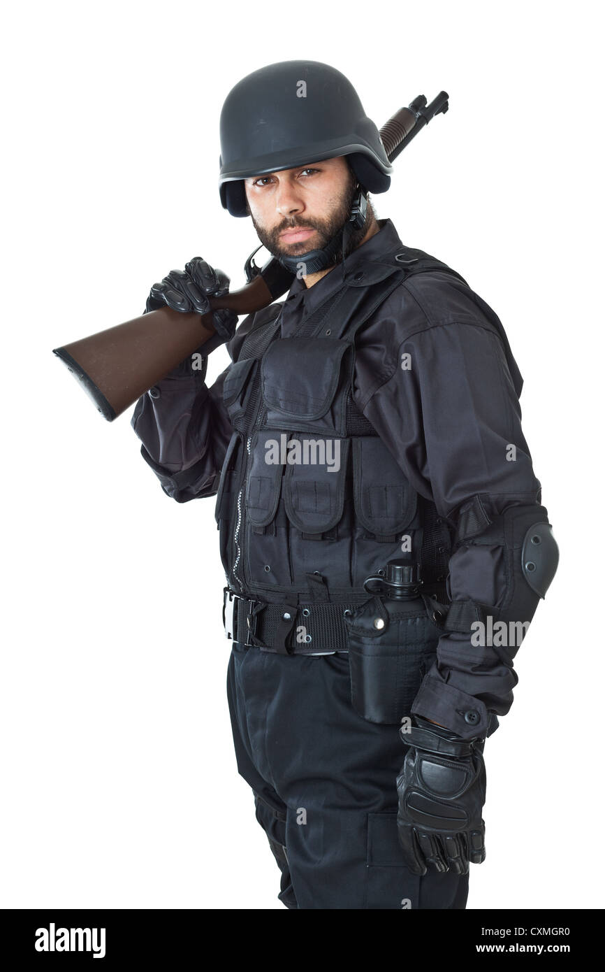 a swat agent wearing a bulletproof vest and aiming with a gun Stock ...