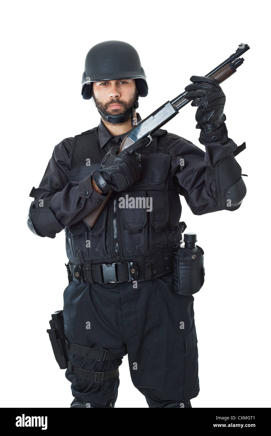 a swat agent wearing a bulletproof vest and aiming with a gun Stock ...
