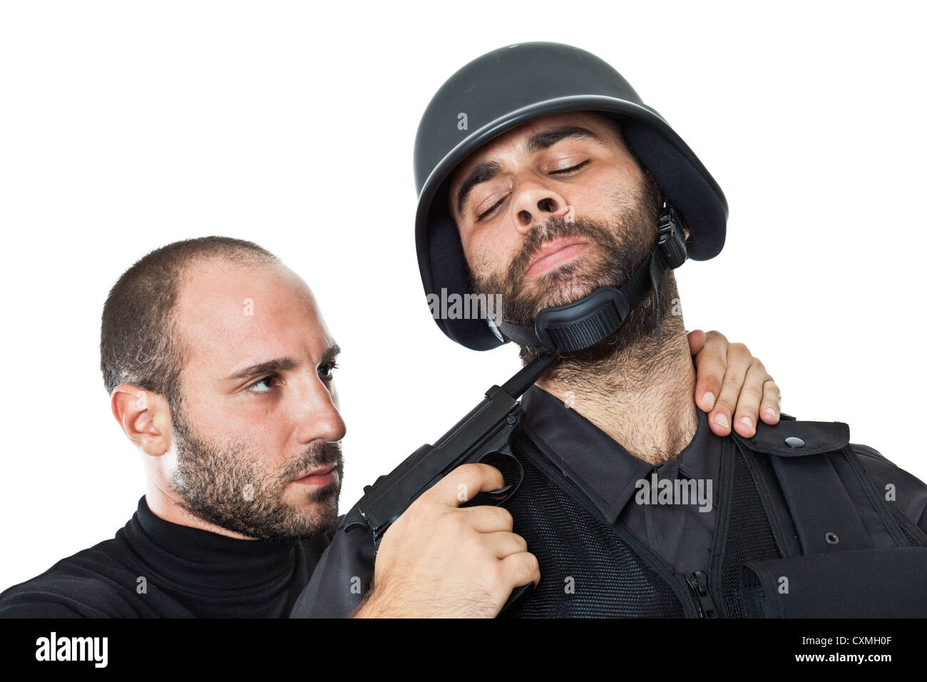 an evil villain threatening a swat officer with a gun Stock Photo - Alamy