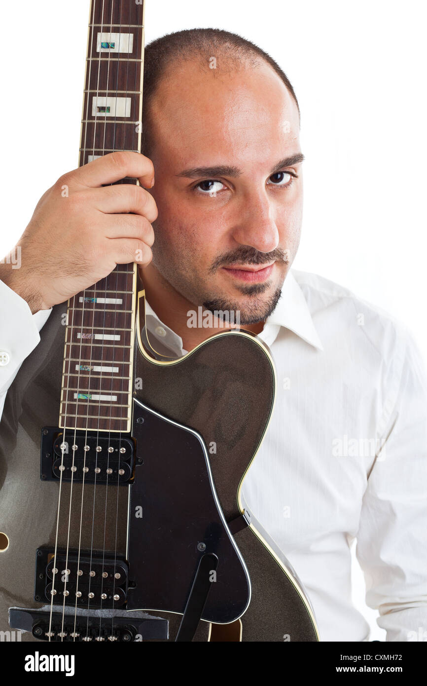 a well dressed jazz musician with a guitar Stock Photo - Alamy