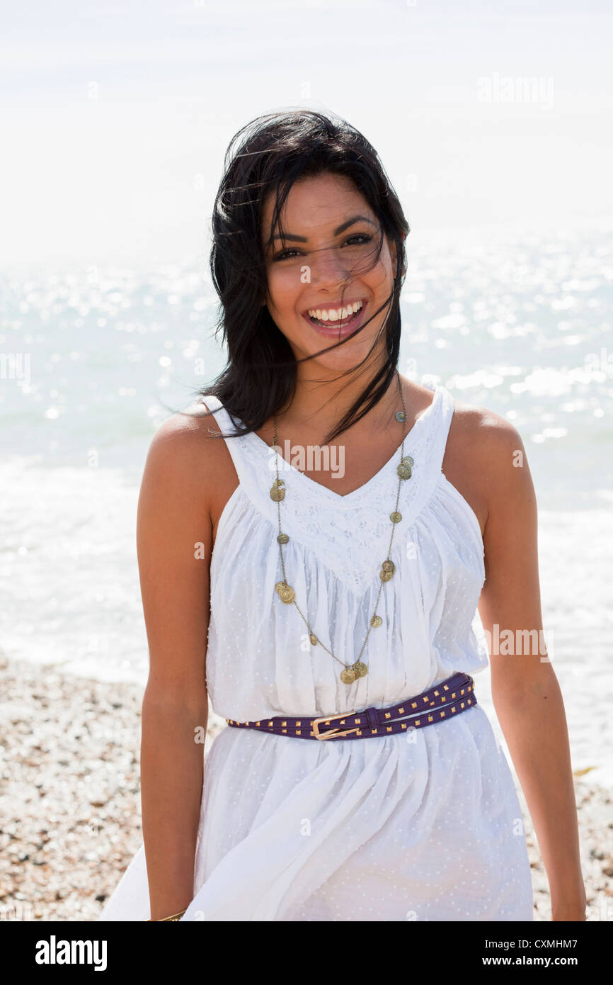Young woman on beach Stock Photo - Alamy