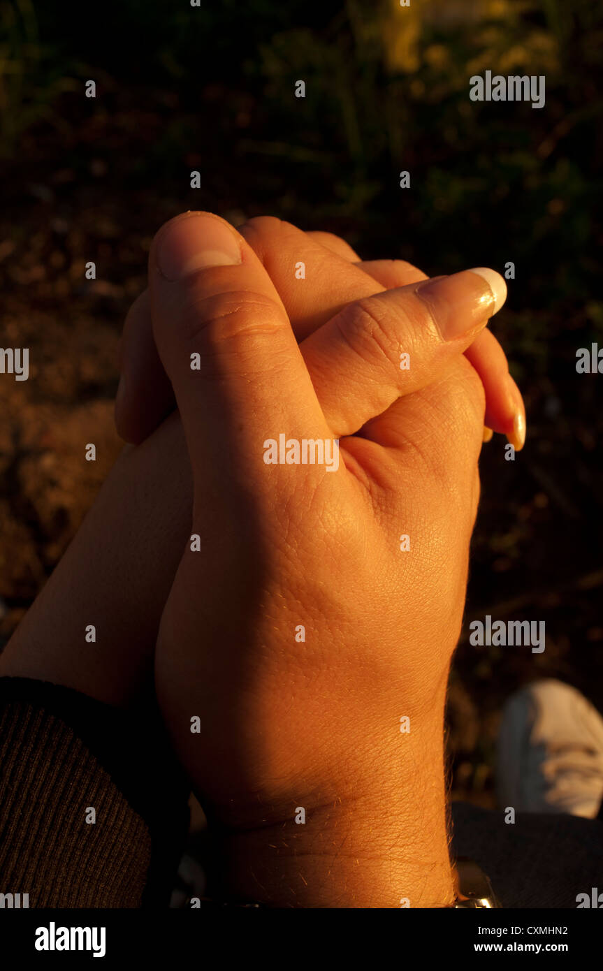 Hand in hand Stock Photo - Alamy