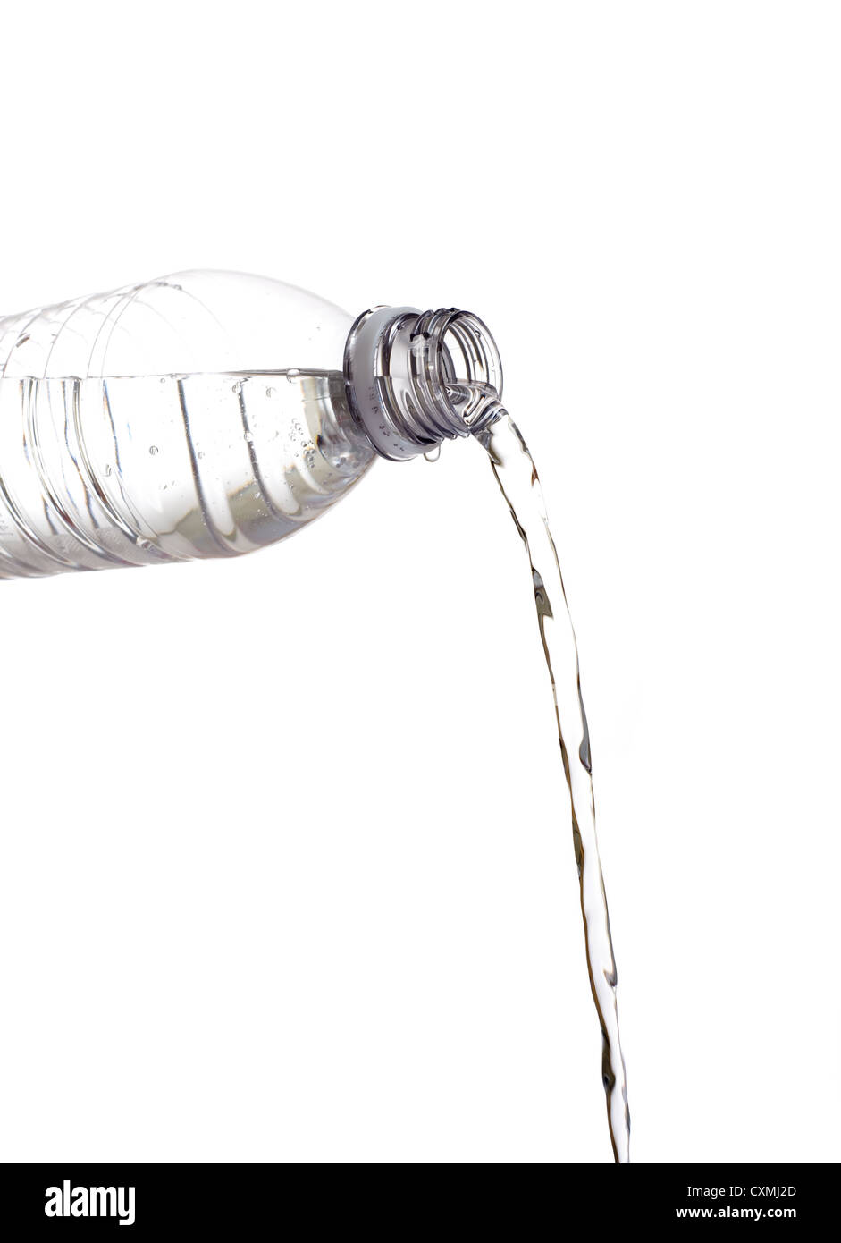 A bottle of water being poured out on a white background with copy ...