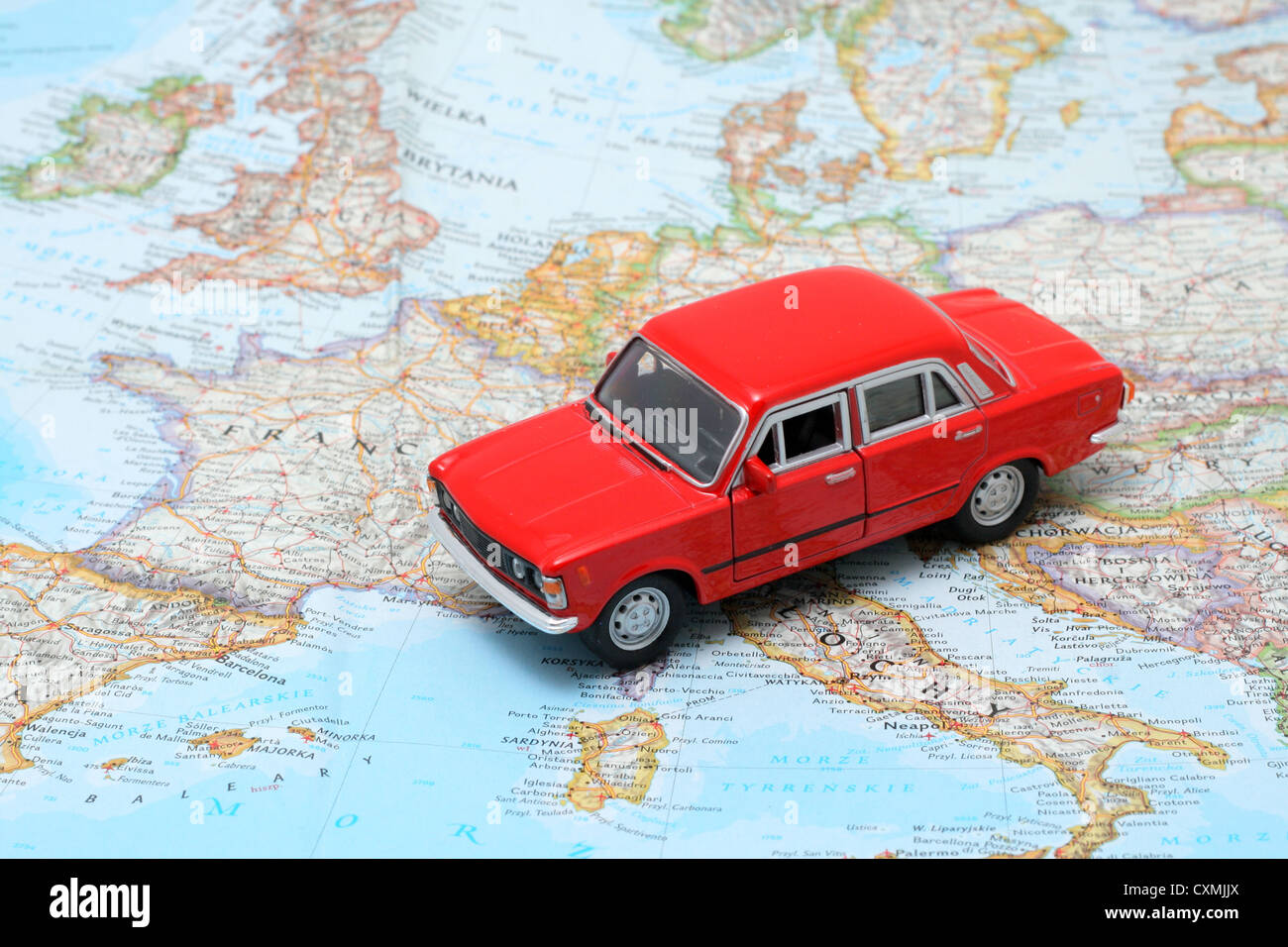 Tiny red car model Stock Photo - Alamy