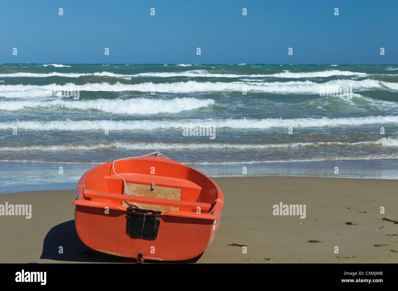 isolated boat on the beach of italian sea Stock Photo - Alamy