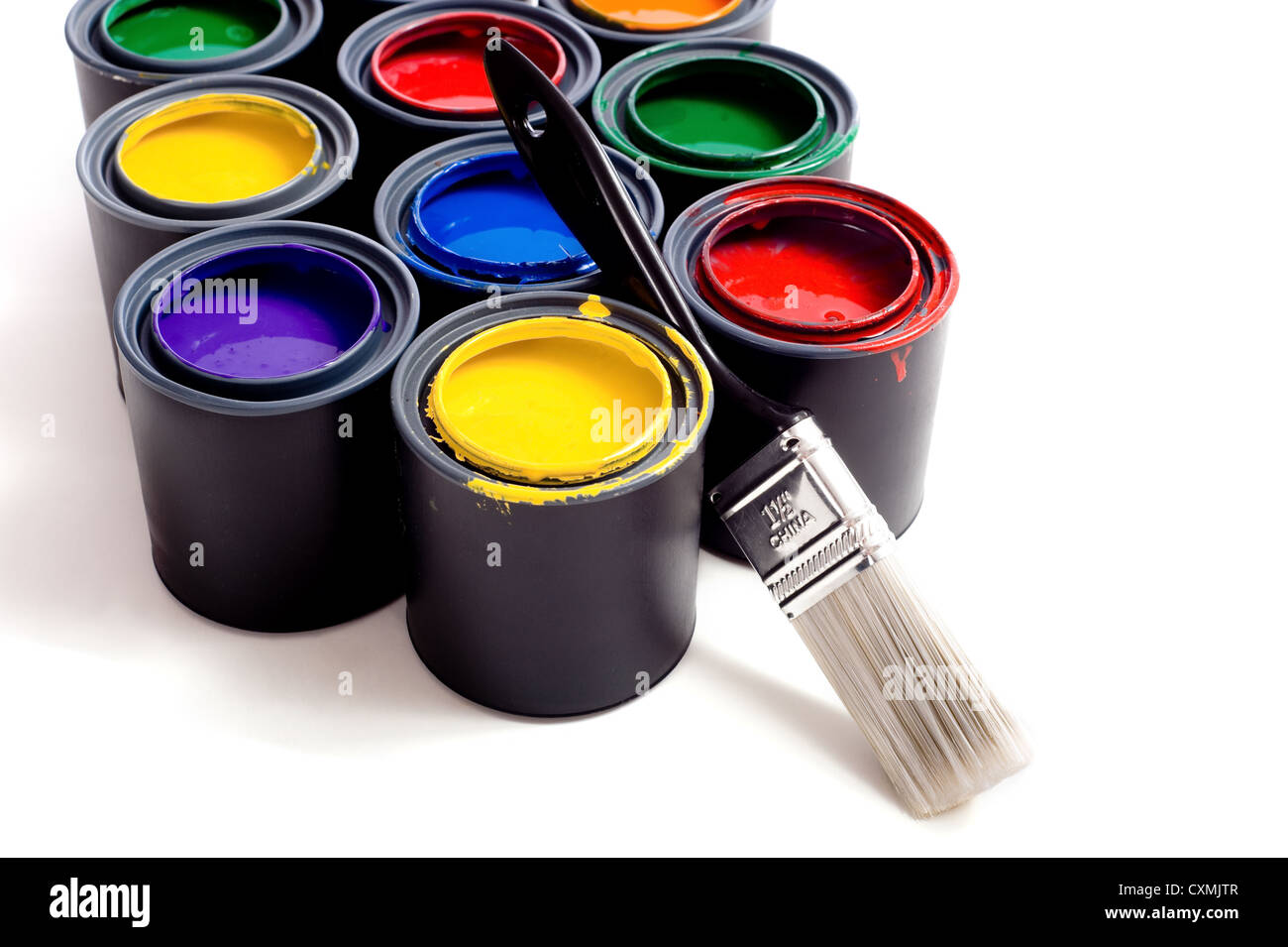Colorful cans of paint and a paint brush on a white background forming ...