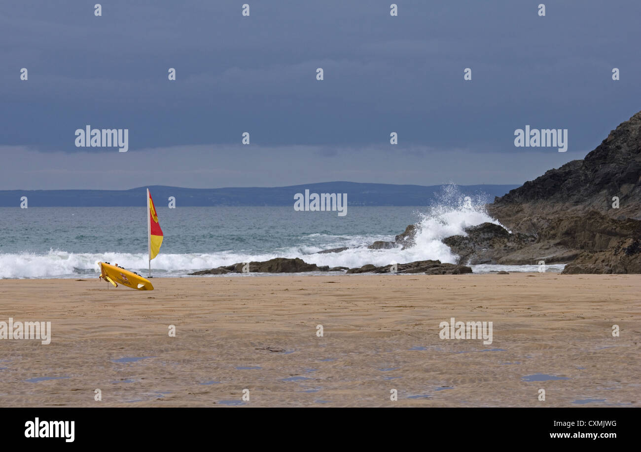 RNLI Royal National Lifeboat Institution lifeguard surf board at Poldhu ...