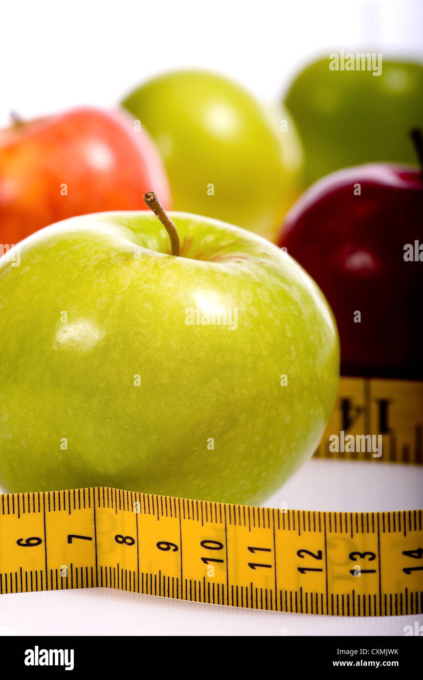 Red and green apples with a tape measure Stock Photo - Alamy