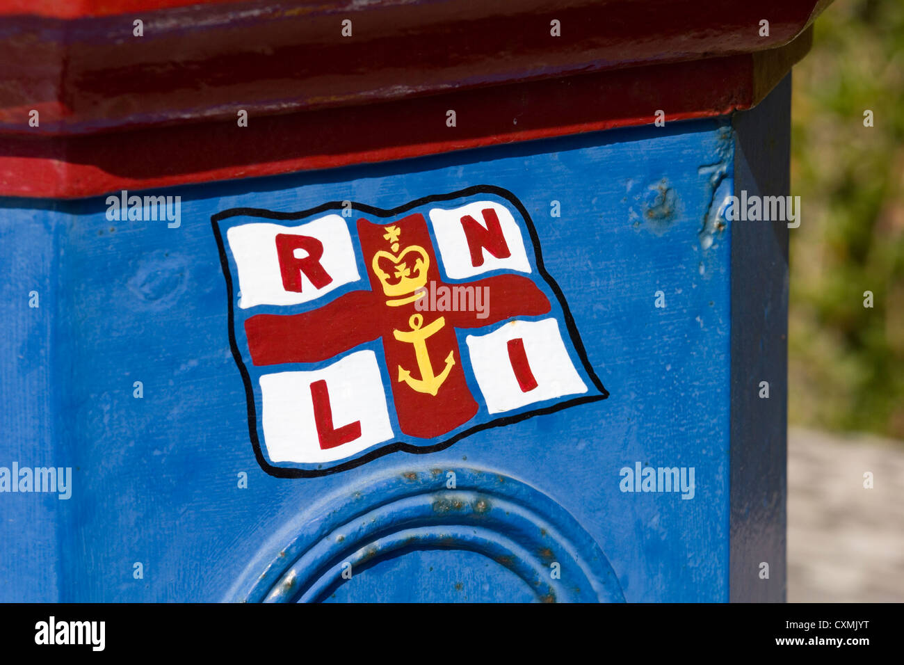 RNLI Royal National Lifeboat Institution flag on a charity box at the ...