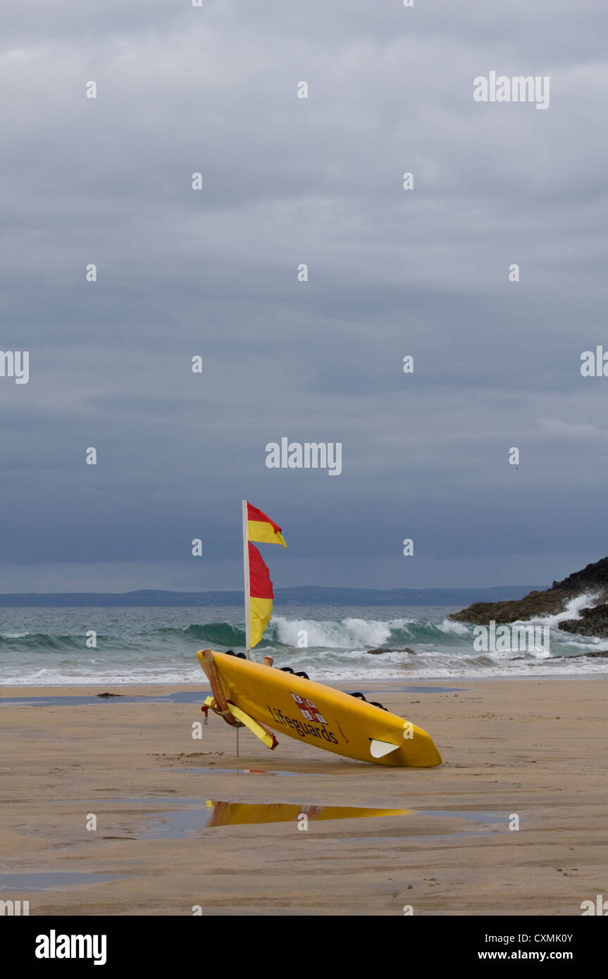 RNLI Royal National Lifeboat Institution lifeguard surf board at Poldhu ...