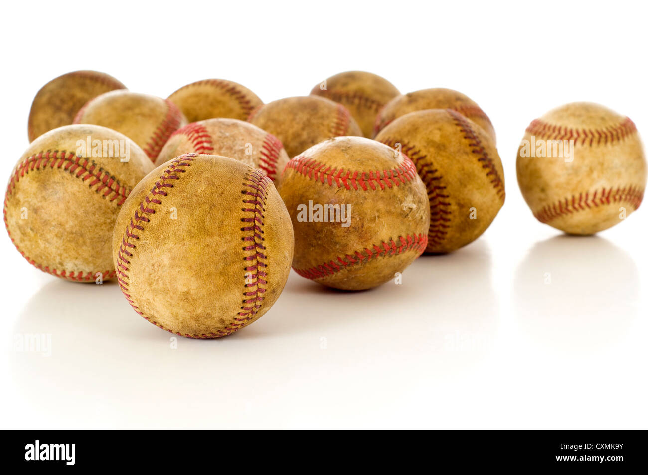 a background of vintage, antique, old baseballs on a white background ...