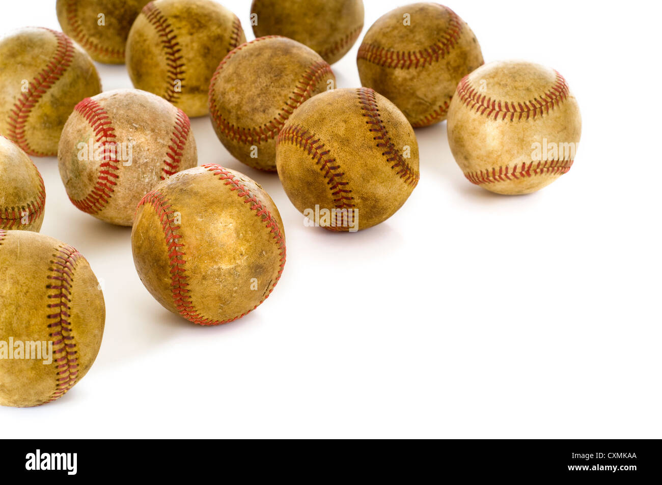 a background of vintage, antique, old baseballs on a white background ...