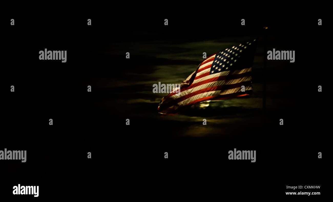 Flag of the United States of America blows in the wind light by a full ...