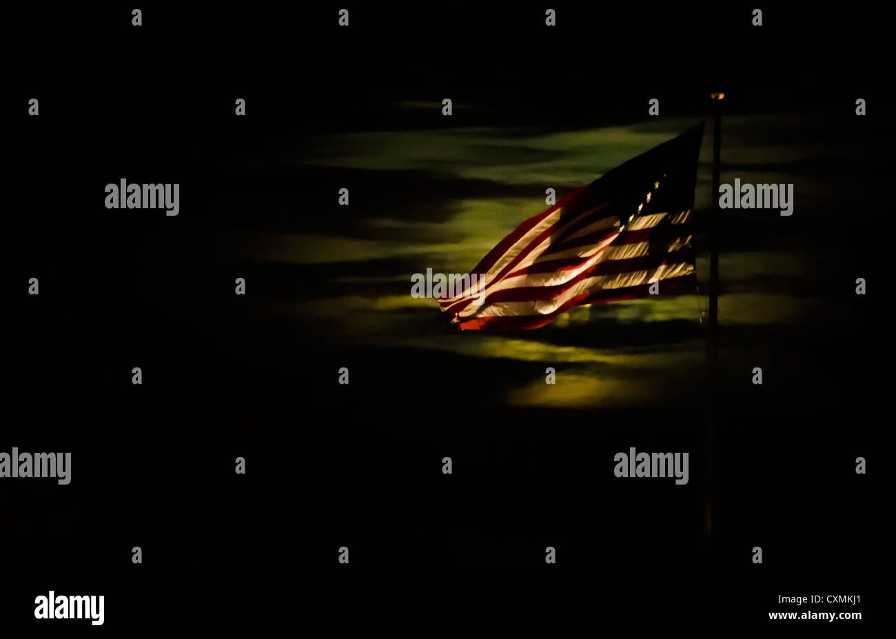 Flag of the United States of America blows in the wind light by a full ...