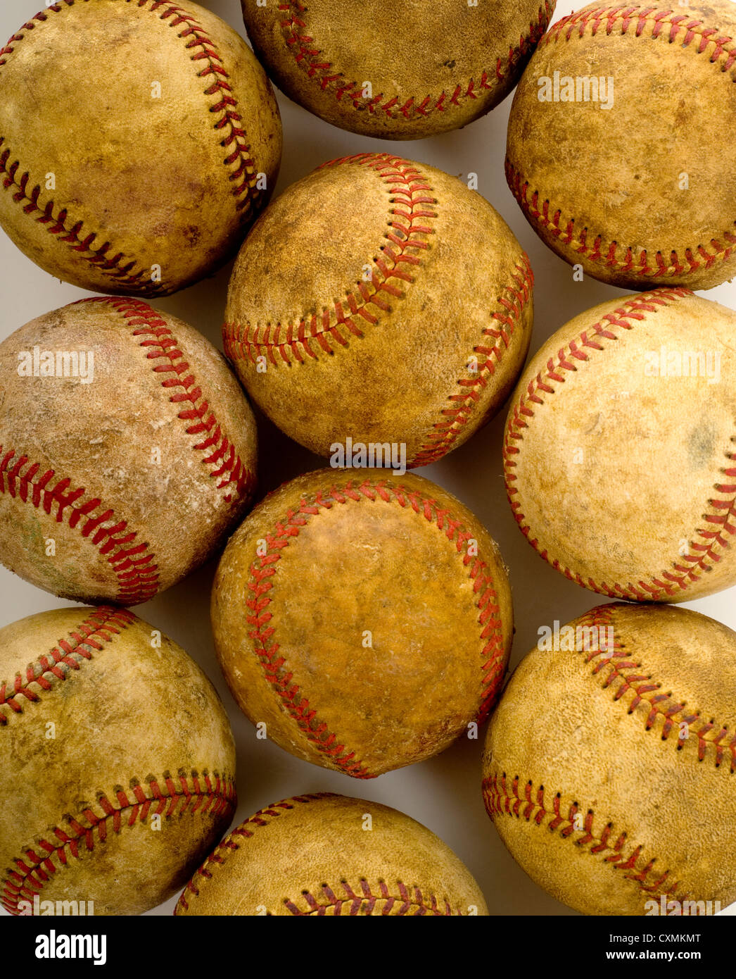 a background of vintage, antique, old baseballs on a white background ...
