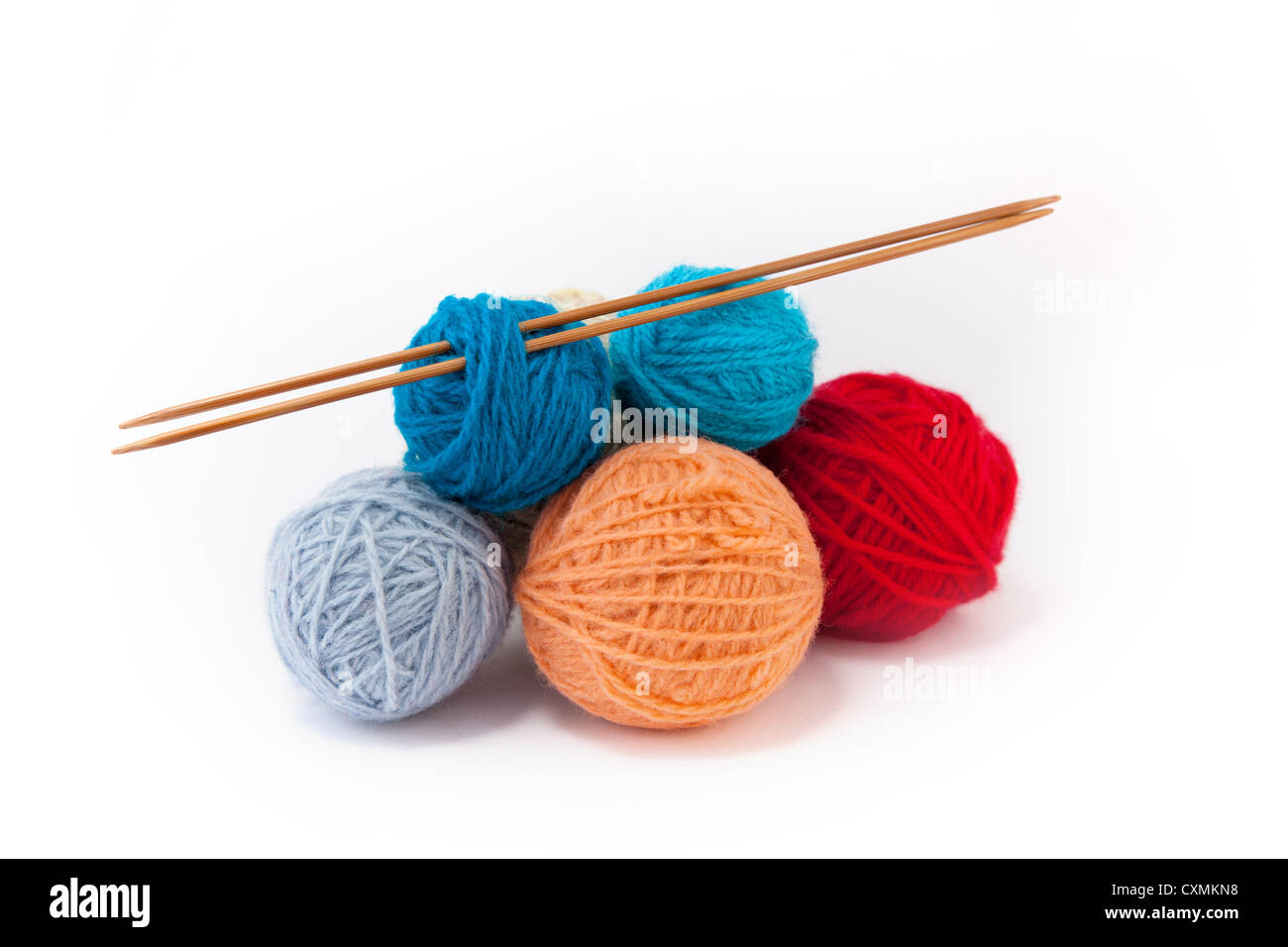 Selection of colorful yarn balls and needles Stock Photo - Alamy