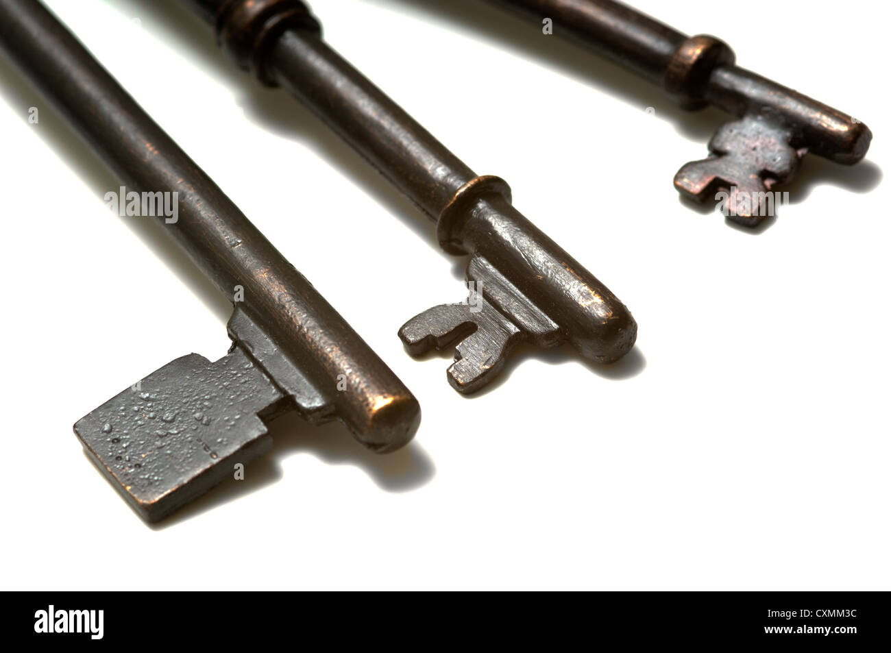 Set of antique, old fashioned keys or jailers keys on white background ...