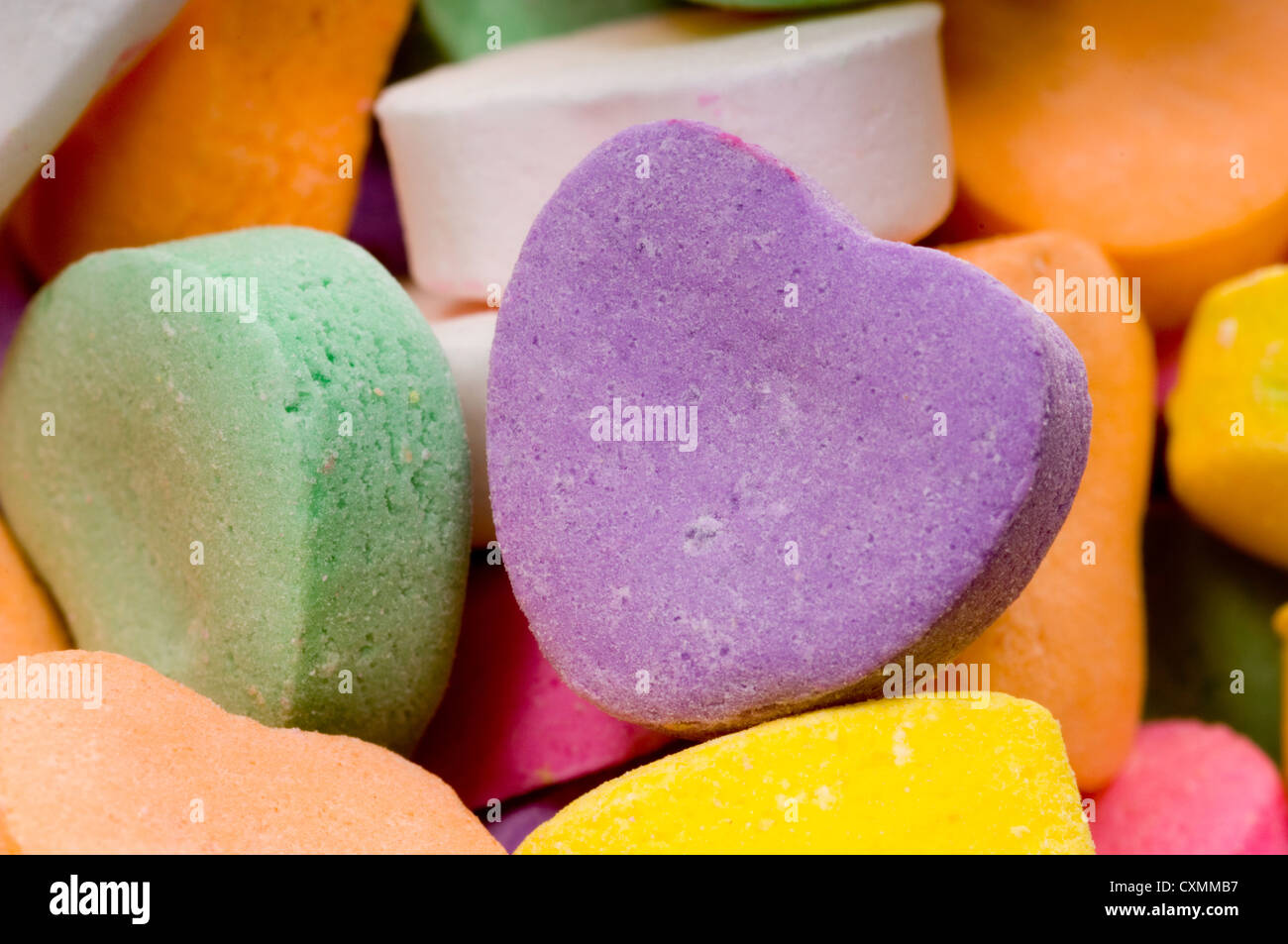 Extreme close-up of tiny candy hearts for Valentine's Day Stock Photo ...