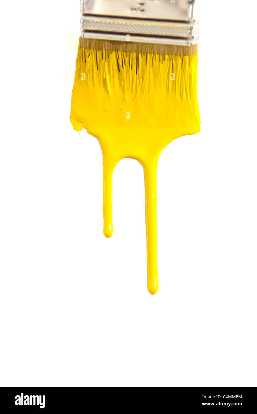 Dripping yellow paint against a bright white background Stock Photo - Alamy