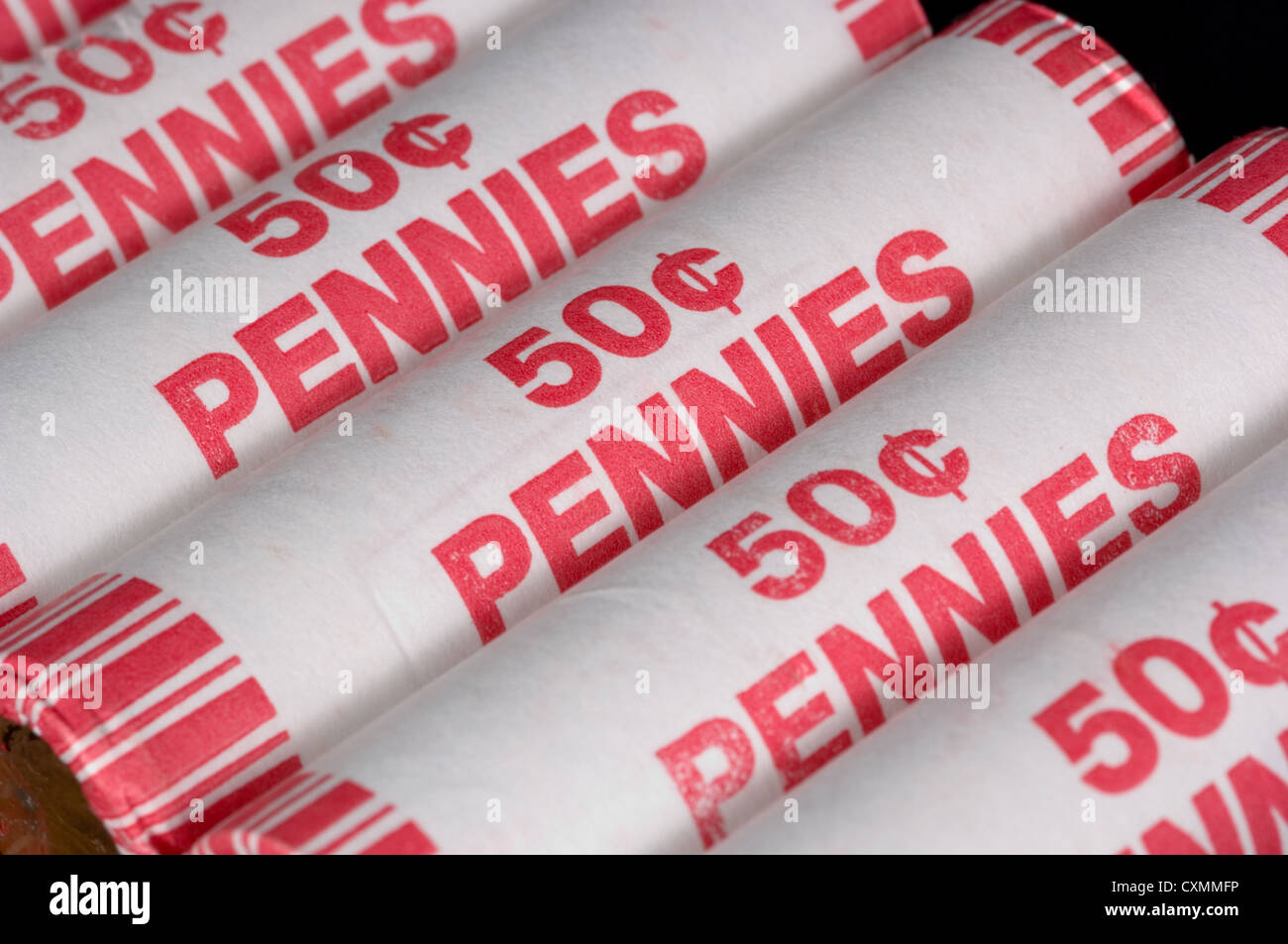 rolls of American pennies on black background Stock Photo - Alamy