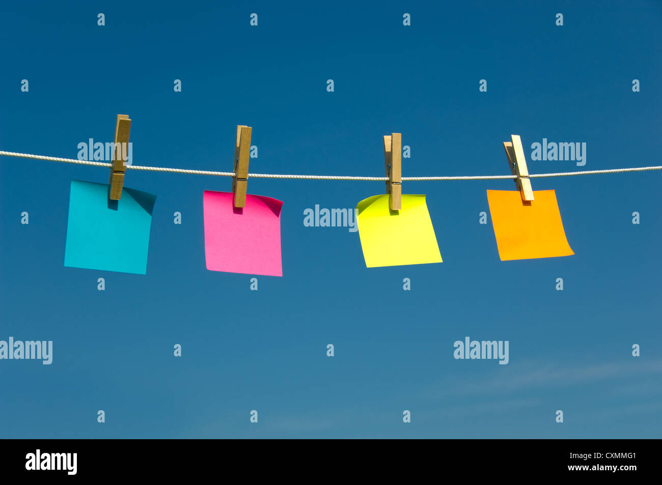 Colored sticky notes on a clothesline with a blue sky background Stock ...