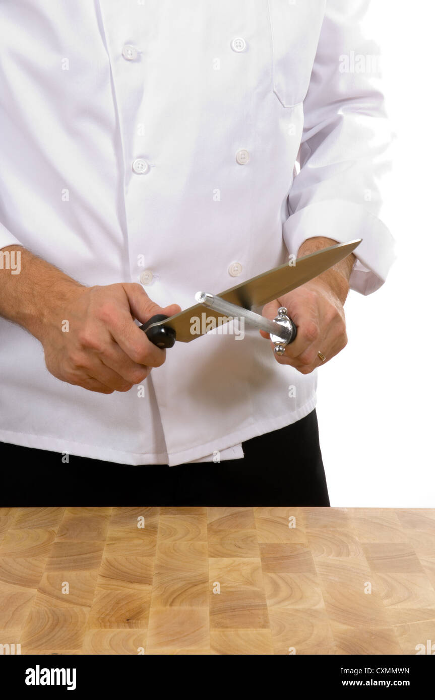 Professional chef (man) sharpening knife with steel Stock Photo - Alamy