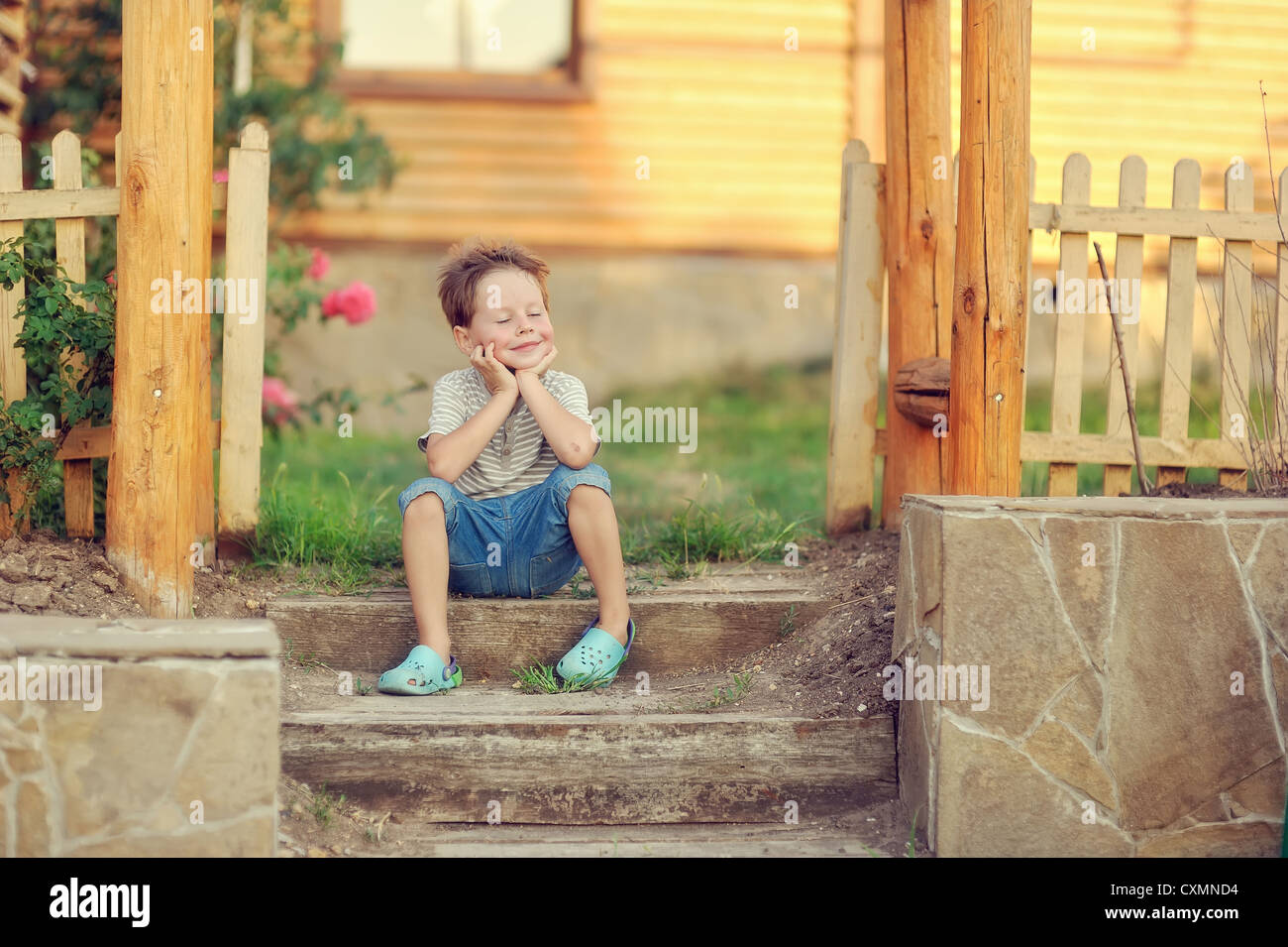 Boy sits on a porch hi-res stock photography and images - Alamy