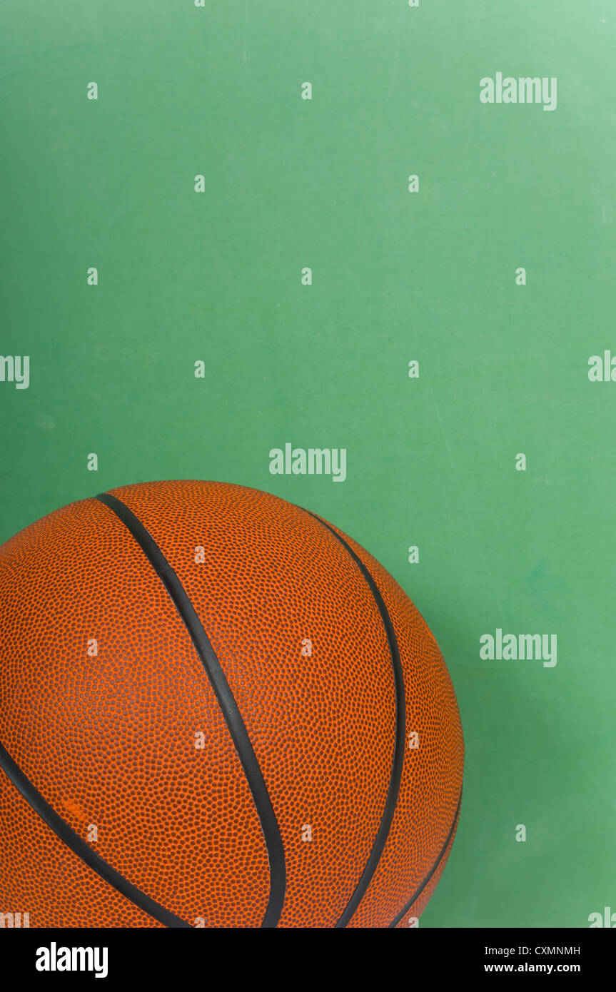 Items used by a basketball coach including a ball and a black board ...