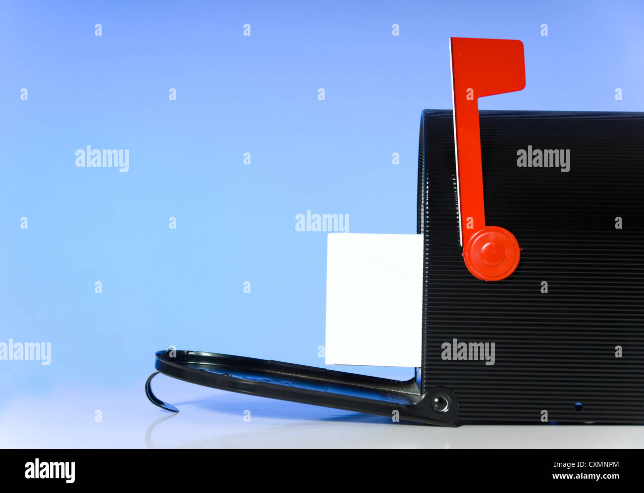 Open mail box with flag up and mail sticking out slightly Stock Photo ...