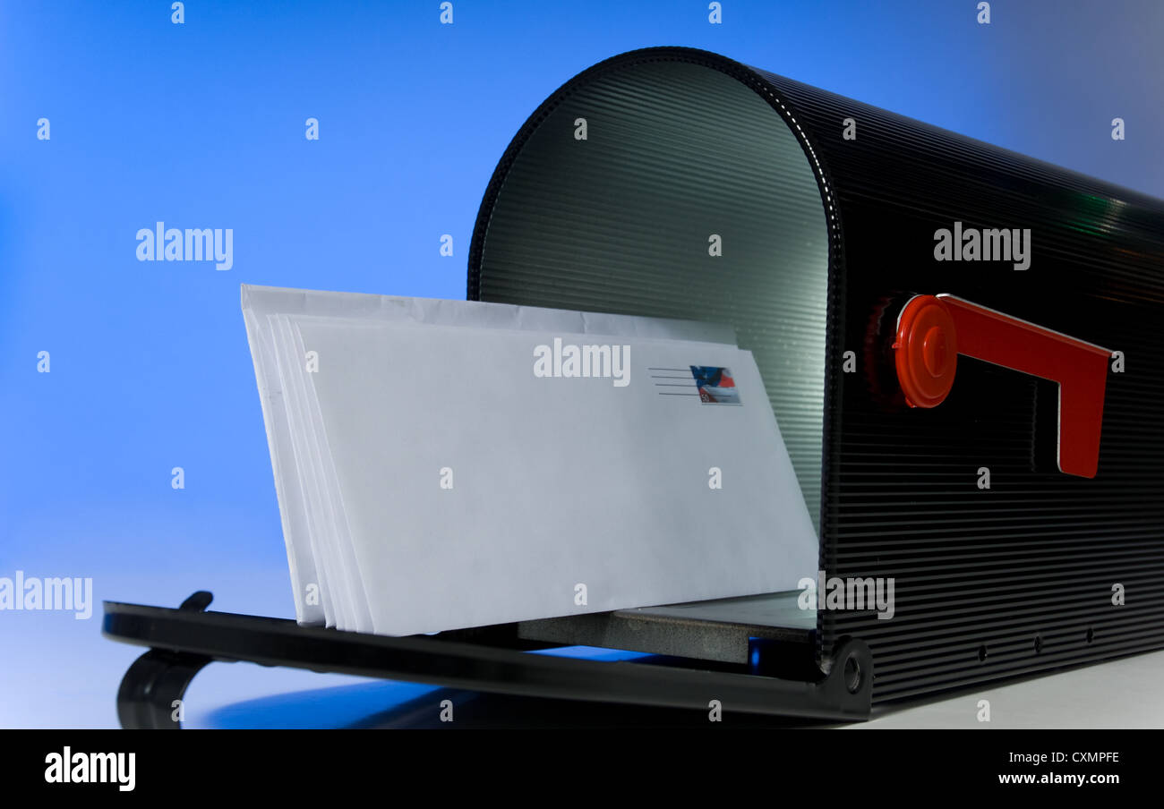 Mail box with blank letter against blue sky - stamp is fake and was ...