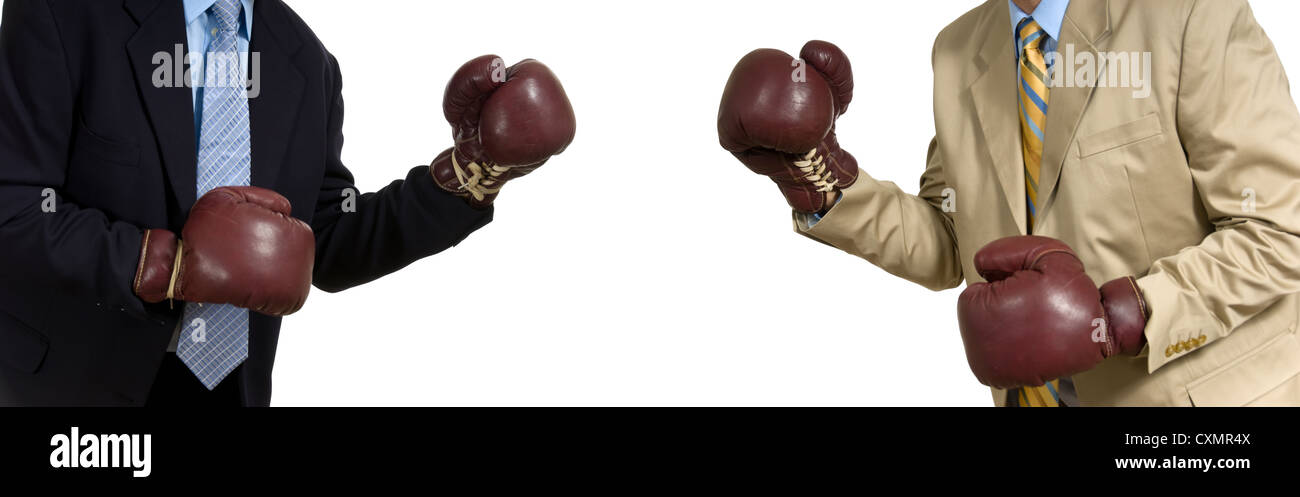 Two business men in business suits in a fight with boxing gloves ...