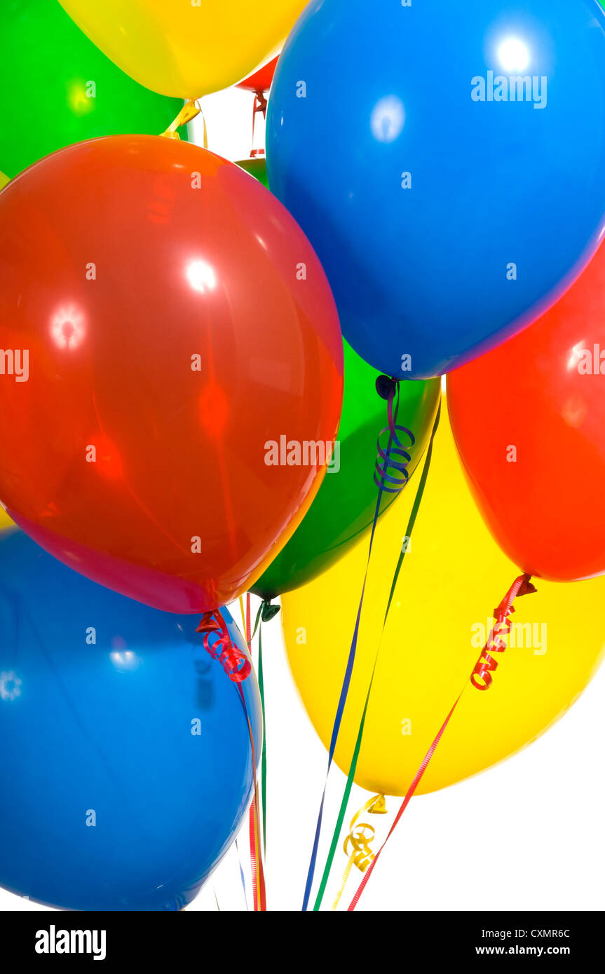 Bouquet of Multicolored party balloons on strings with a white ...