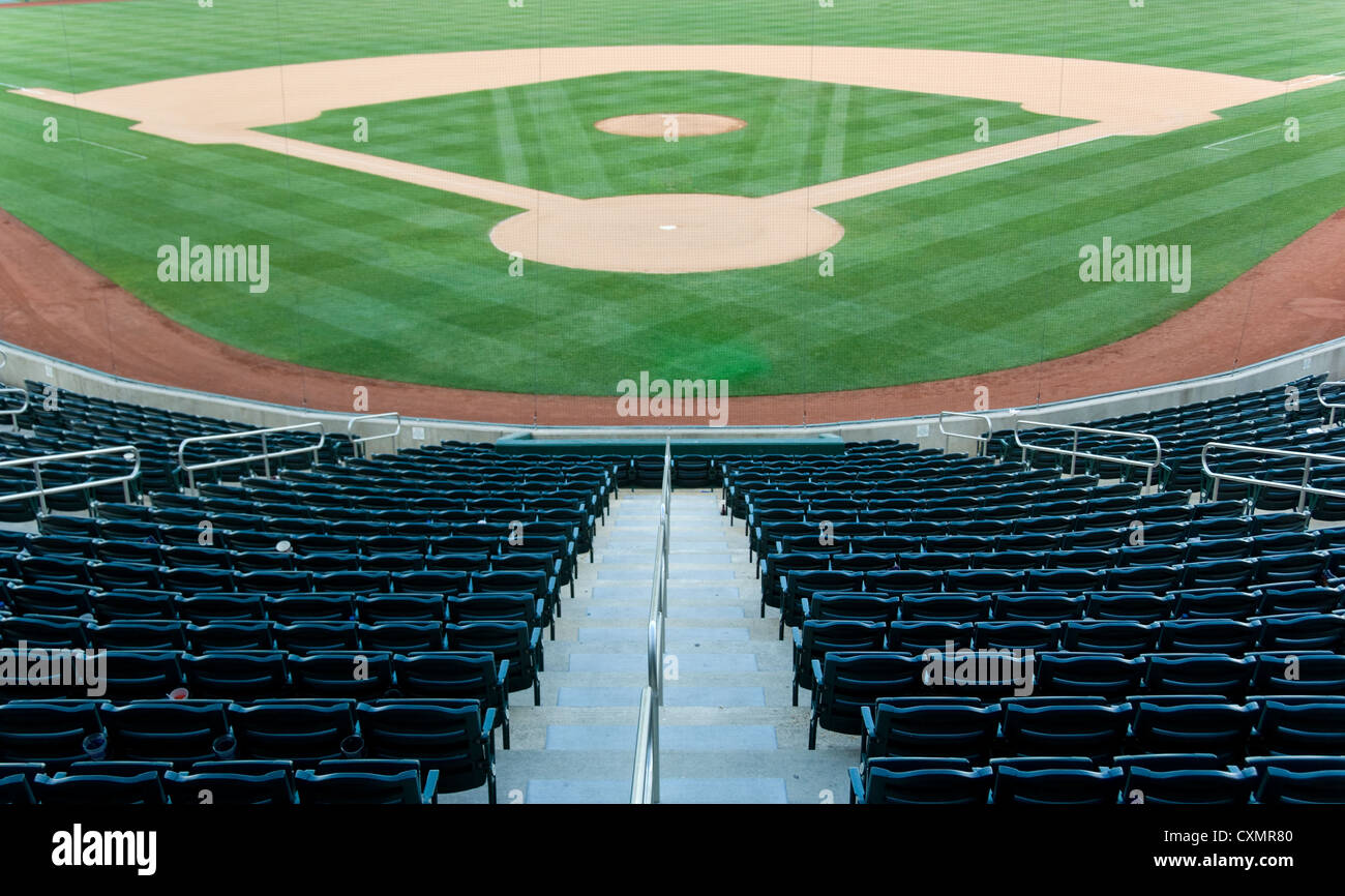 Baseball stadium with seating and a baseball diamond with green grass ...