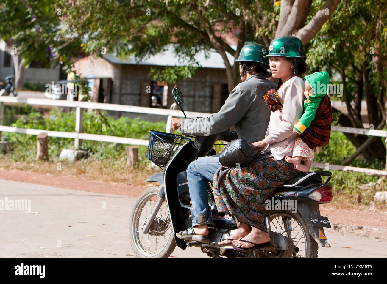 Myanmar, Burma, Kalaw. Family on Motorbike, Helmets on Parents Stock ...