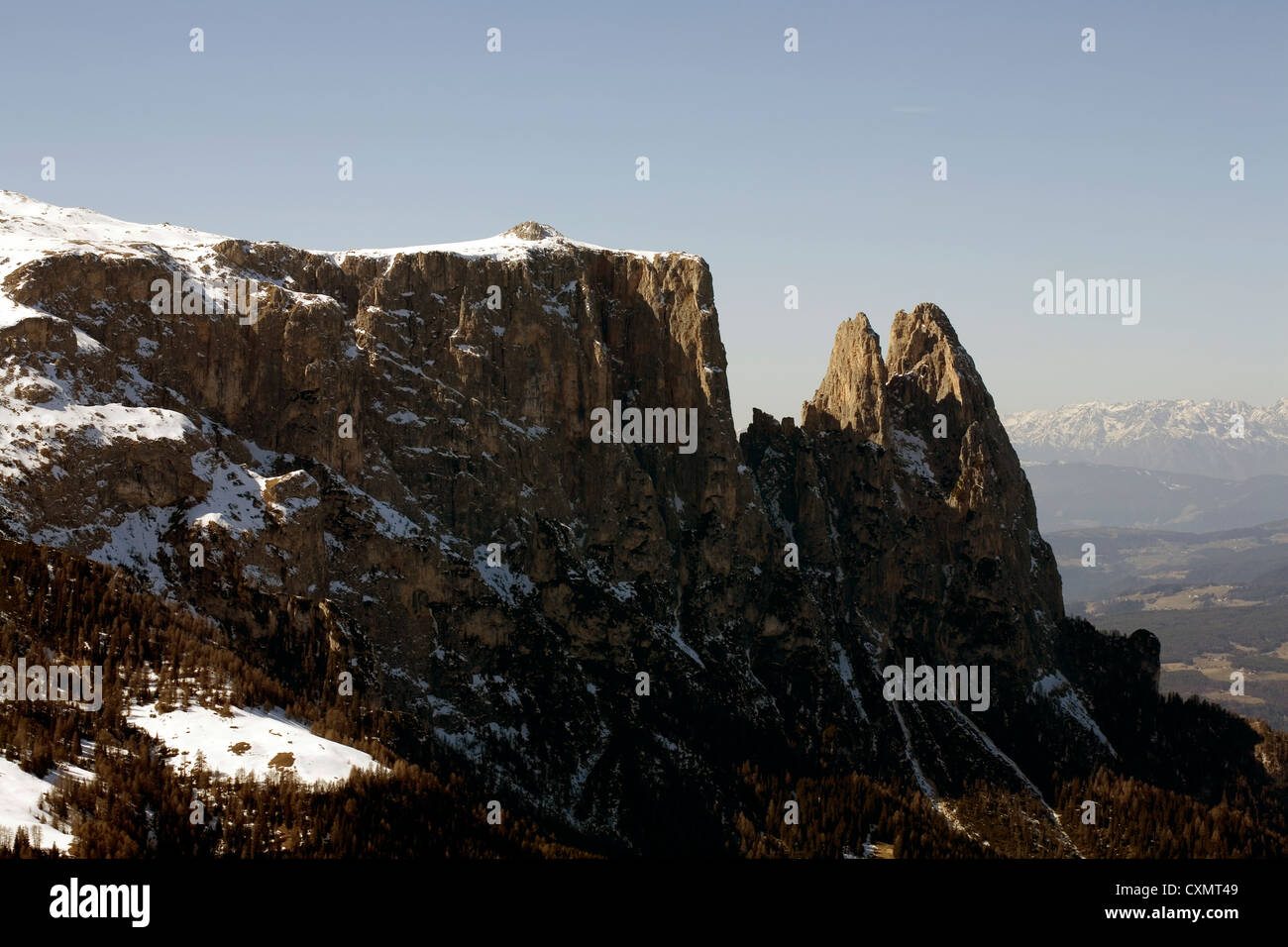 The snow capped peaks of The Sciliar Schlern with the outcrops of ...