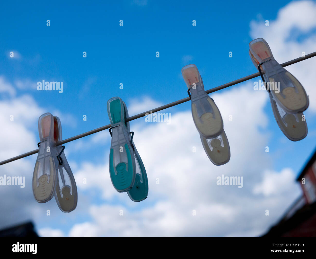 Clothes Pegs on washing line Stock Photo - Alamy