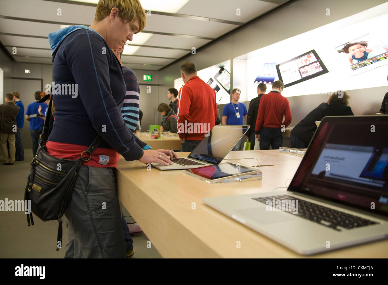 Belfast Northern Ireland Customers in Apple Store testing equipment on ...