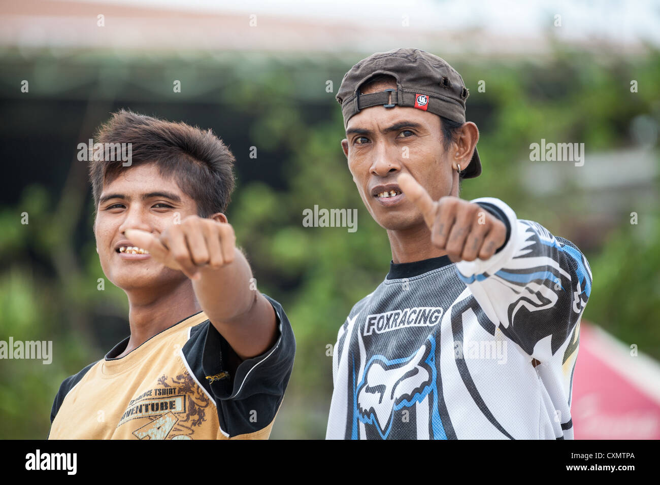 Balinese Men on Kuta Beach on Bali Stock Photo - Alamy