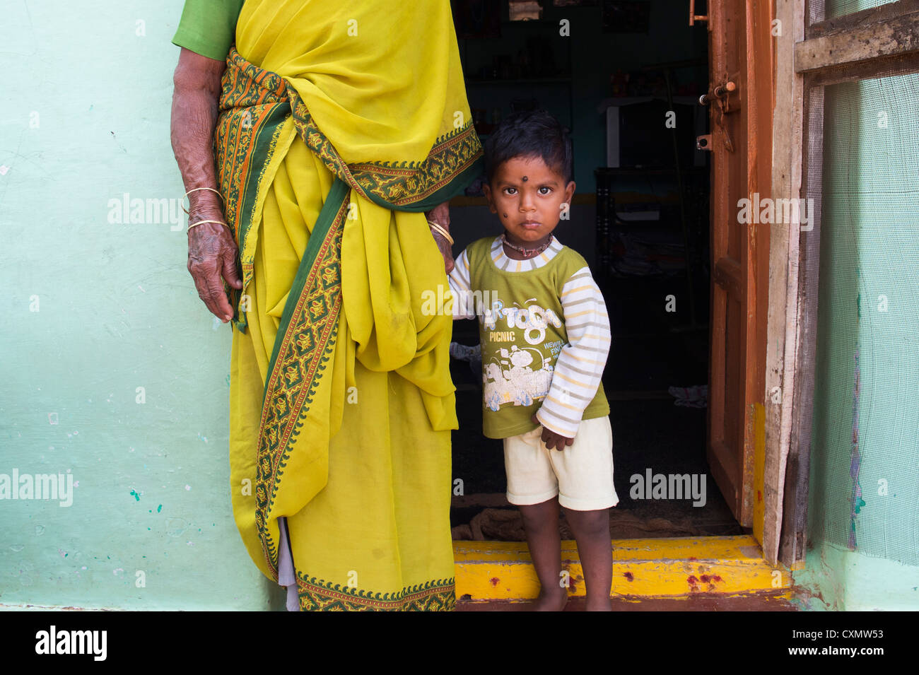 Indian grandmother and baby boy in a rural indian village. Andhra ...