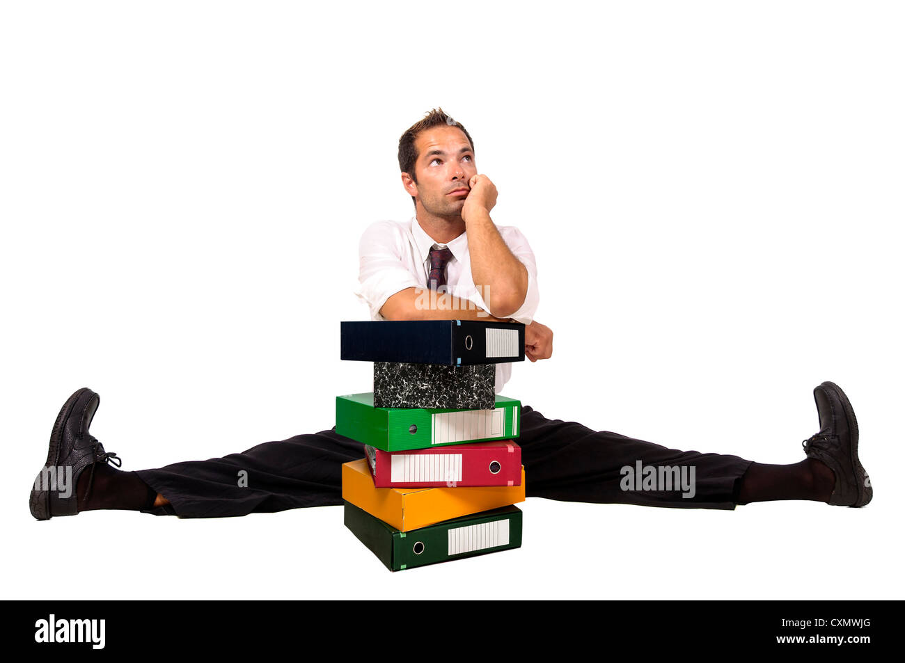 Businessman doing splits with a stack of files Stock Photo - Alamy