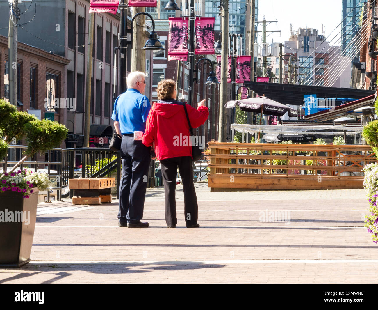 Mature Couple Strolling through Yaletown Neighborhood in Vancouver ...